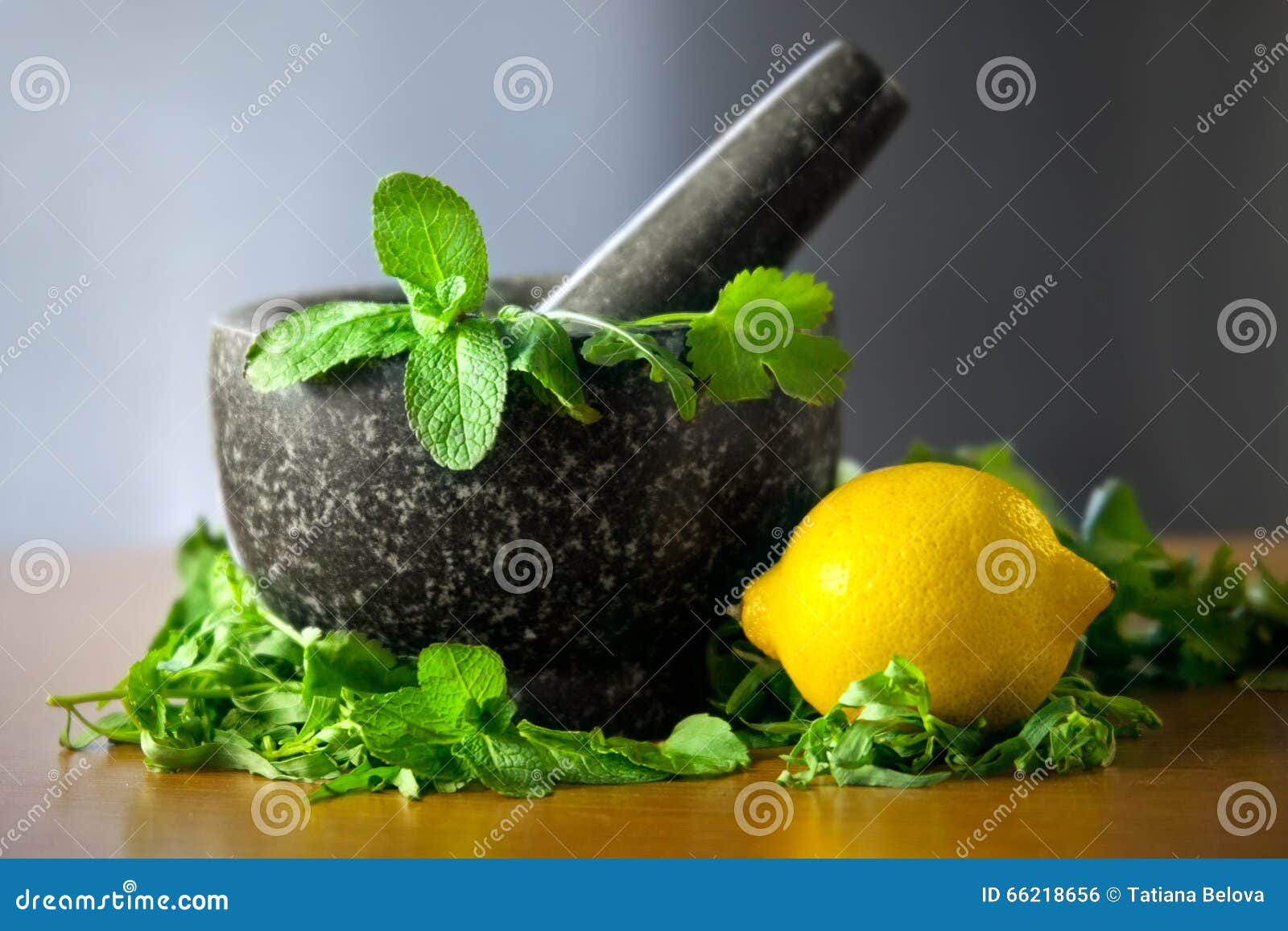 Herb Leaf Selection in a Granite Mortar with Pestle with Lemon Stock ...