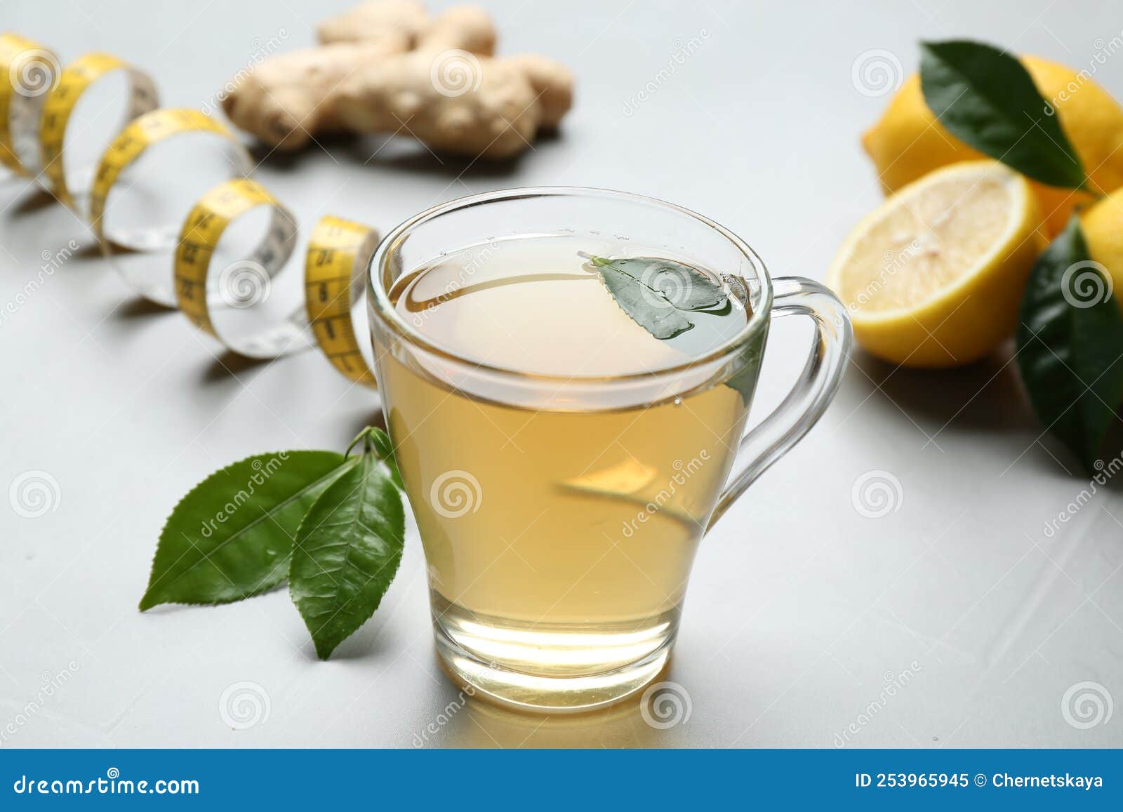 Herbal Diet Tea, Lemon, Ginger and Measuring Tape on Light Table Stock ...