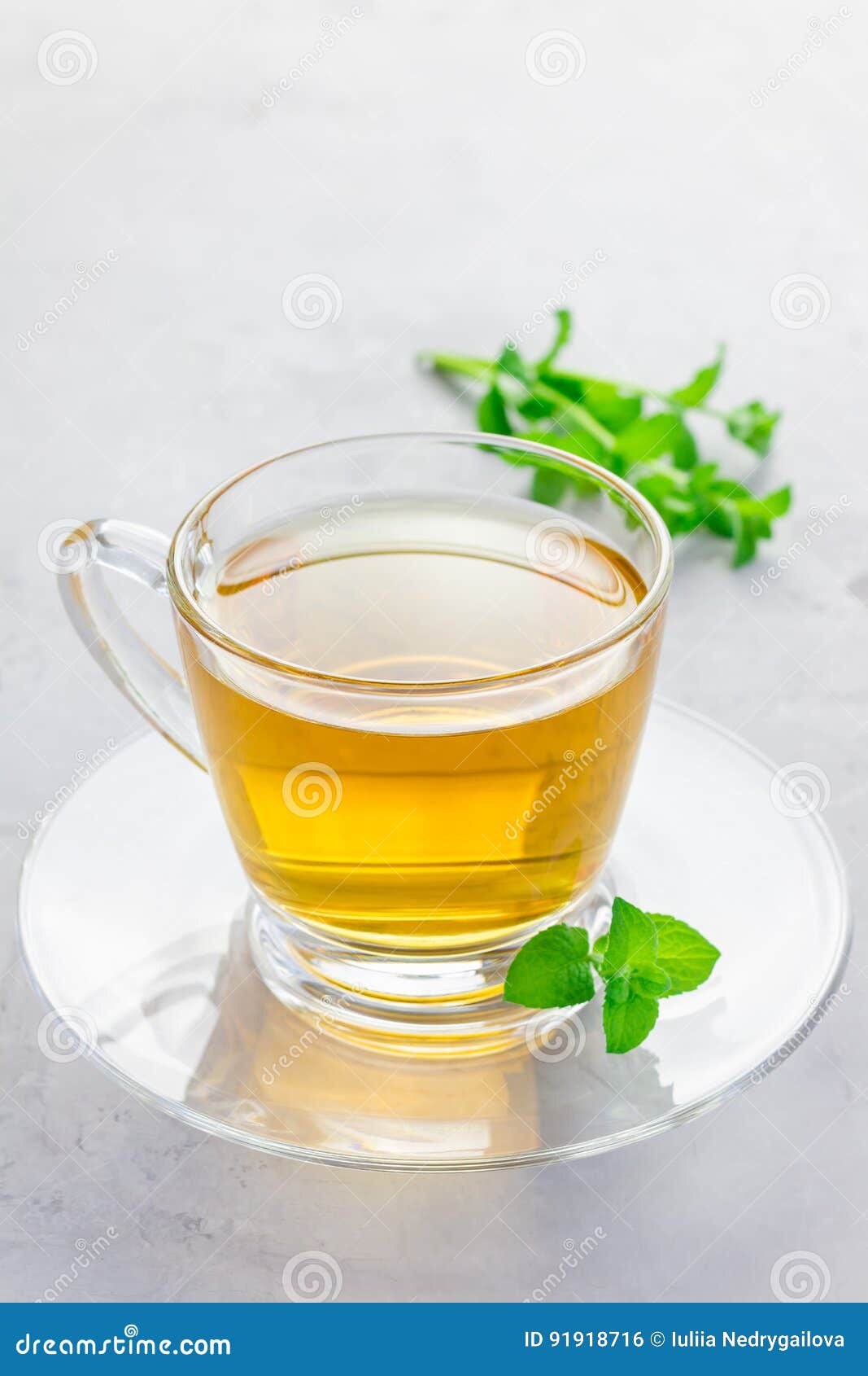 Herbal Mint Tea in a Glass Cup with Fresh Peppermint on Background ...