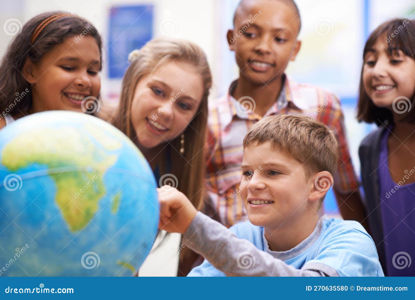 Here it is - Geography Class. a Group of Pupils Looking at a Globe ...