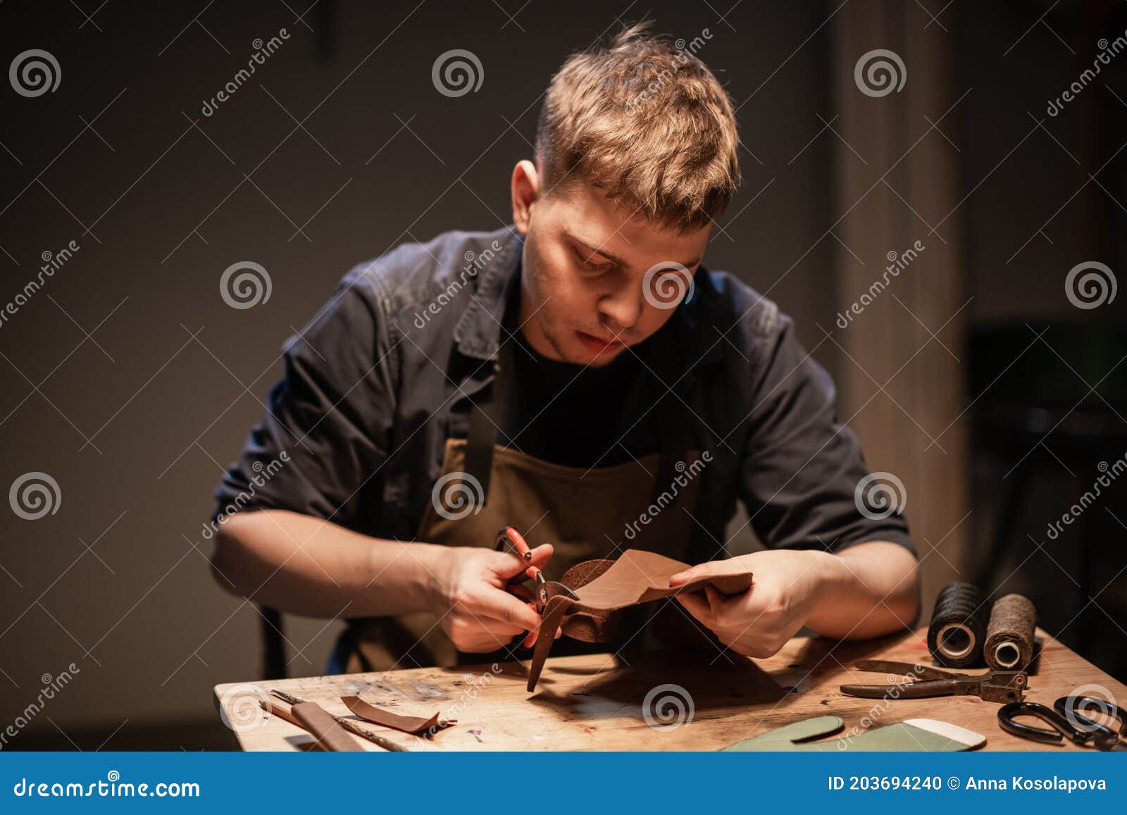 A Hereditary Shoemaker Makes Shoes from Leather in the Family Workshop ...