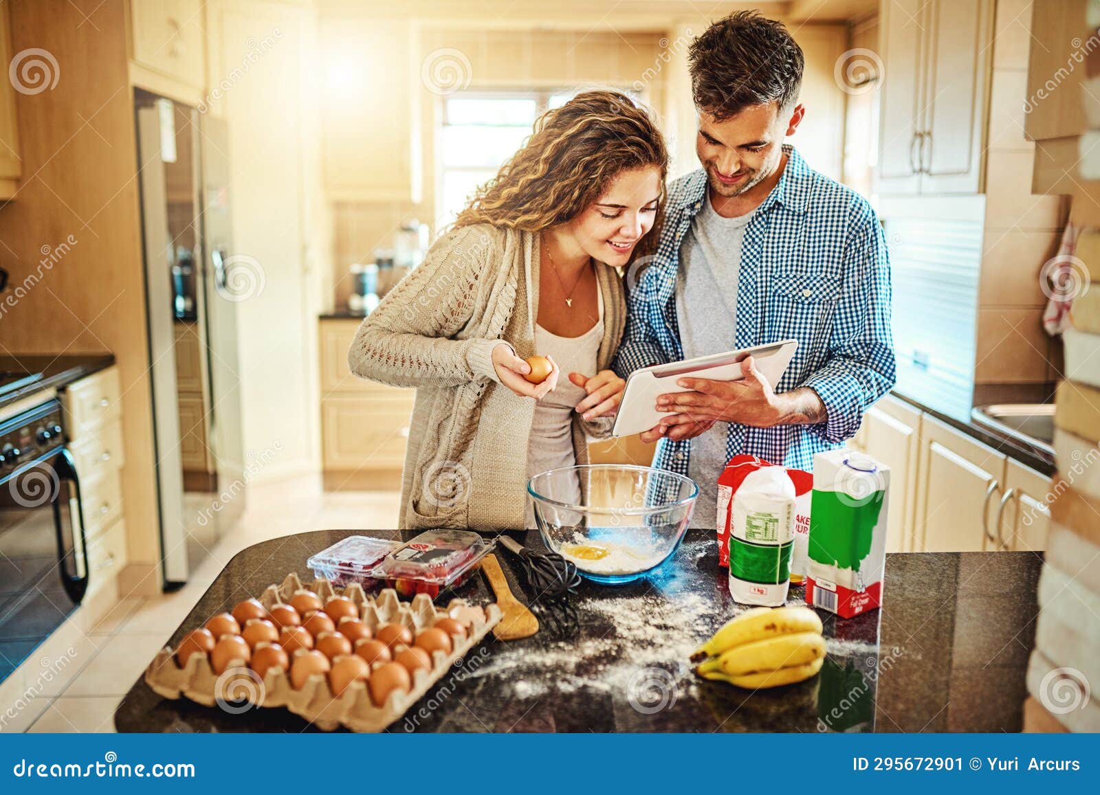 Heres Your Next Instruction. a Young Couple Mixing Ingredients in Their ...