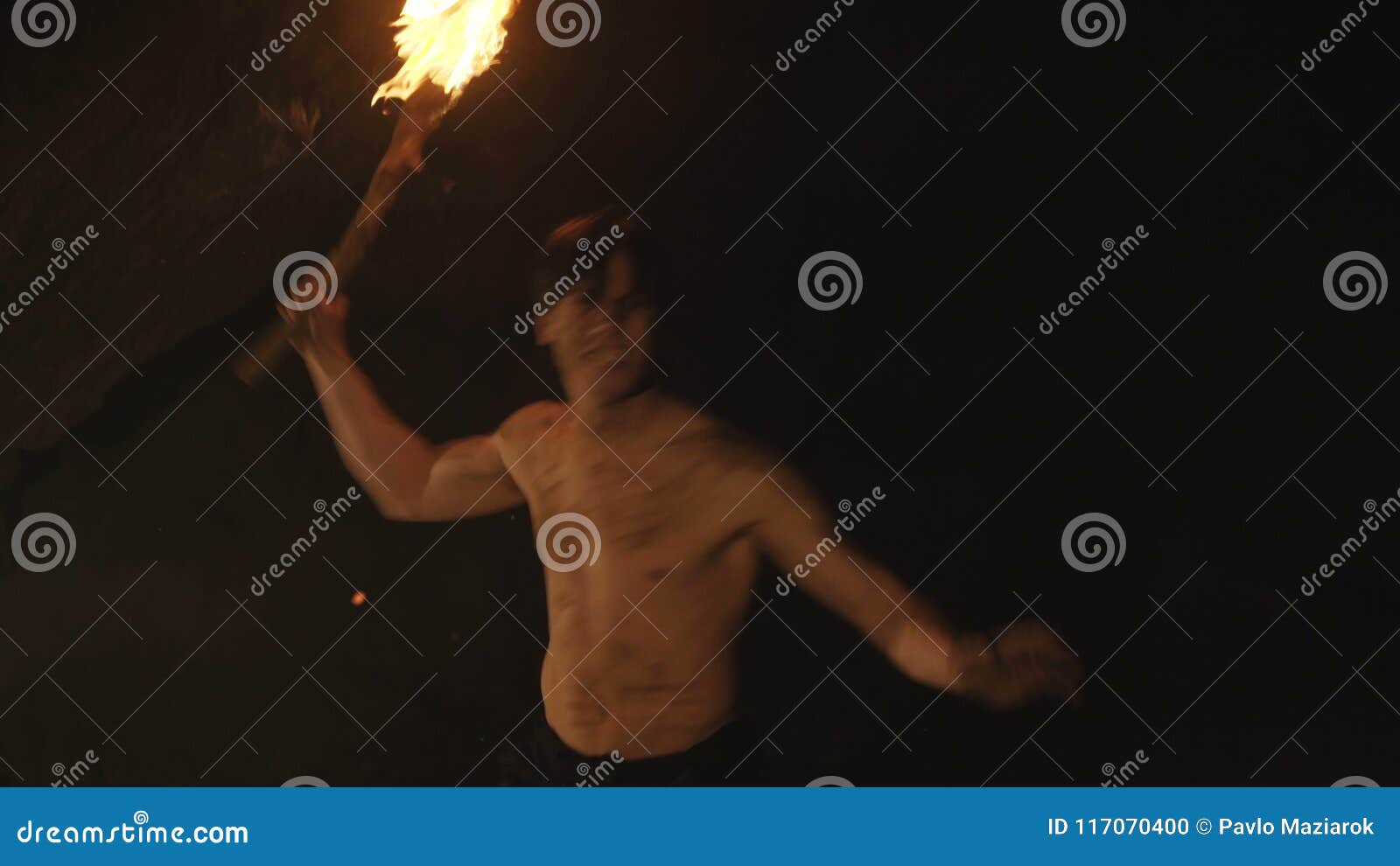 The Hermit Fighting with Torch in Hands at Camera in a Stone Cave Stock ...