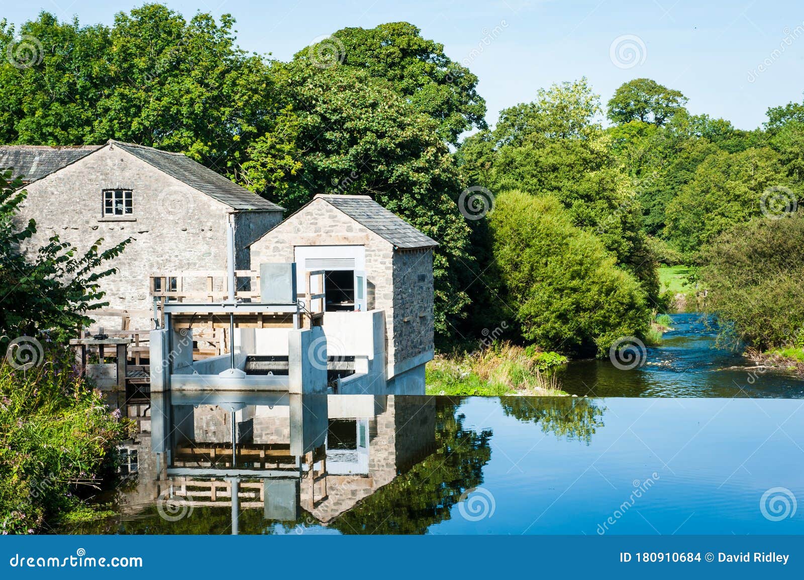 Heron Corn Mill on the River Bela Beetham Cumbria UK Stock Photo ...
