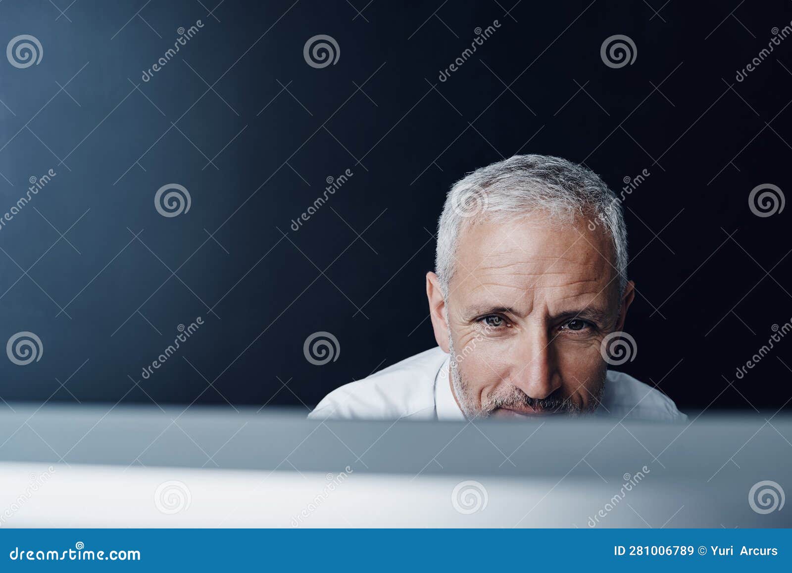 Hes always Behind His Computer Screen. a Mature Businessman Working on ...