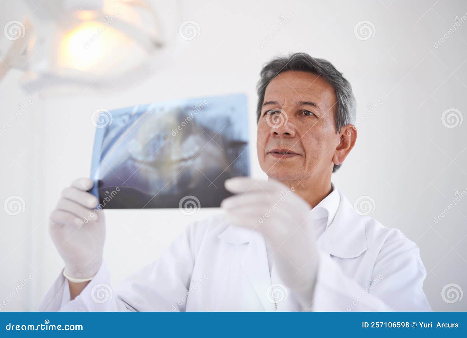 Hes Checking on Your Teeth. a Dentist Looking at an X-ray. Stock Photo ...