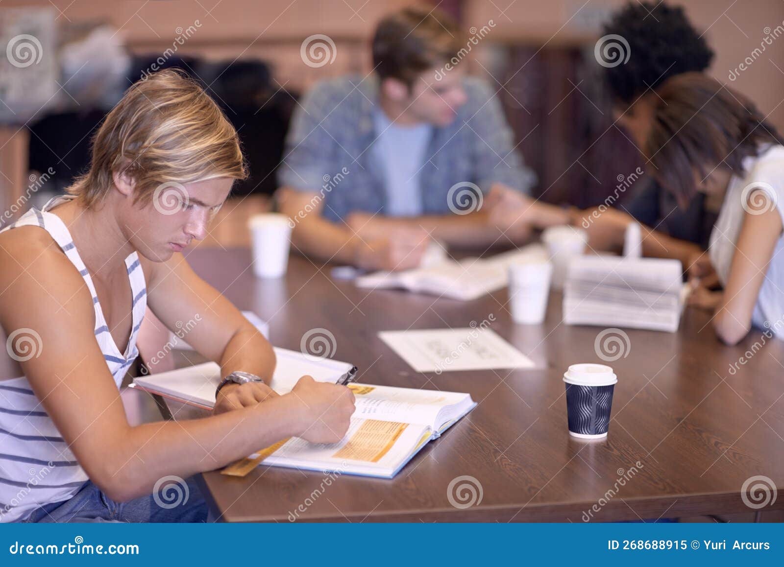 Hes a Committed Student. a Young Man Studying for Exams in the Library ...