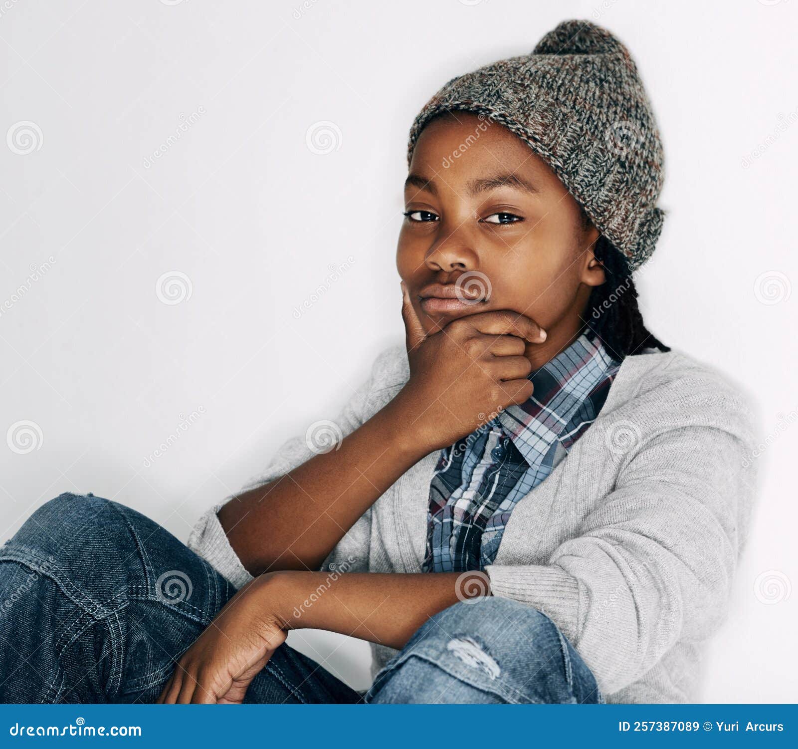Hes a Cool Kid. Portrait of a Young Boy Sitting in the Studio. Stock ...