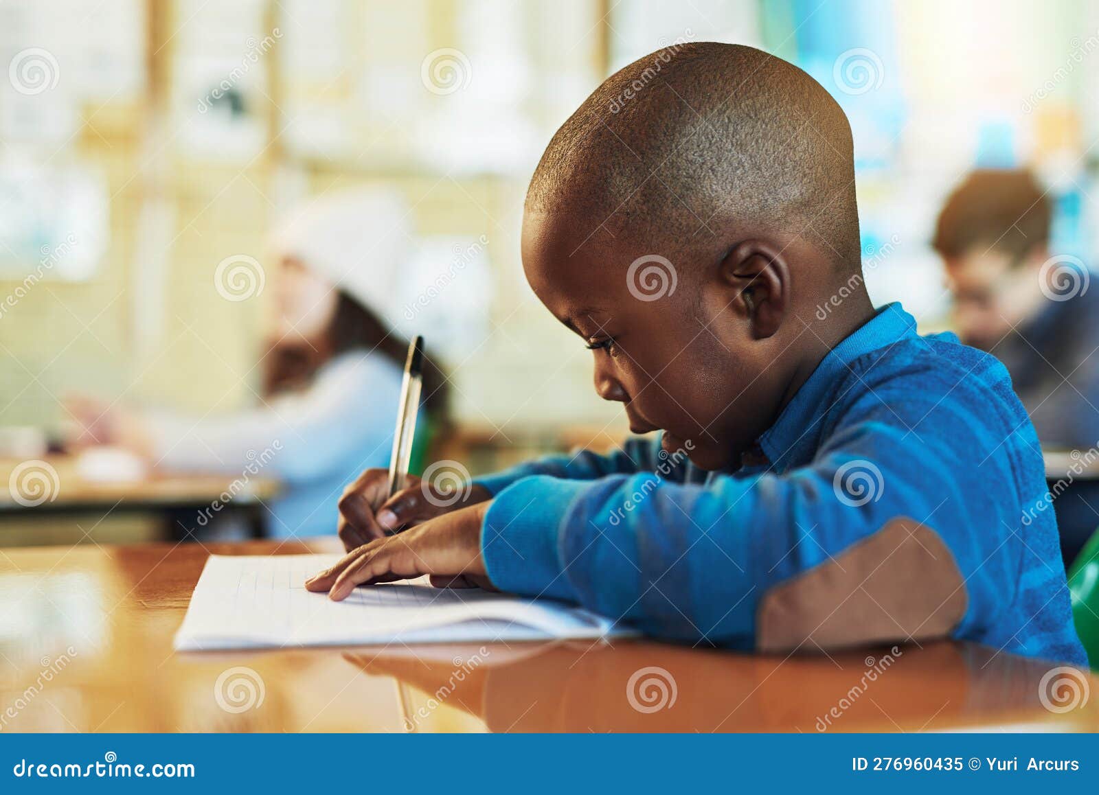 Hes a Dedicated Scholar Already. an Adorable Elementary School Boy ...