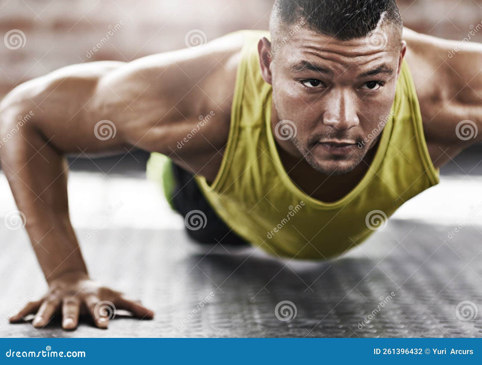 Hes always Down for a Workout. a Young Man Working Out in the Gym ...