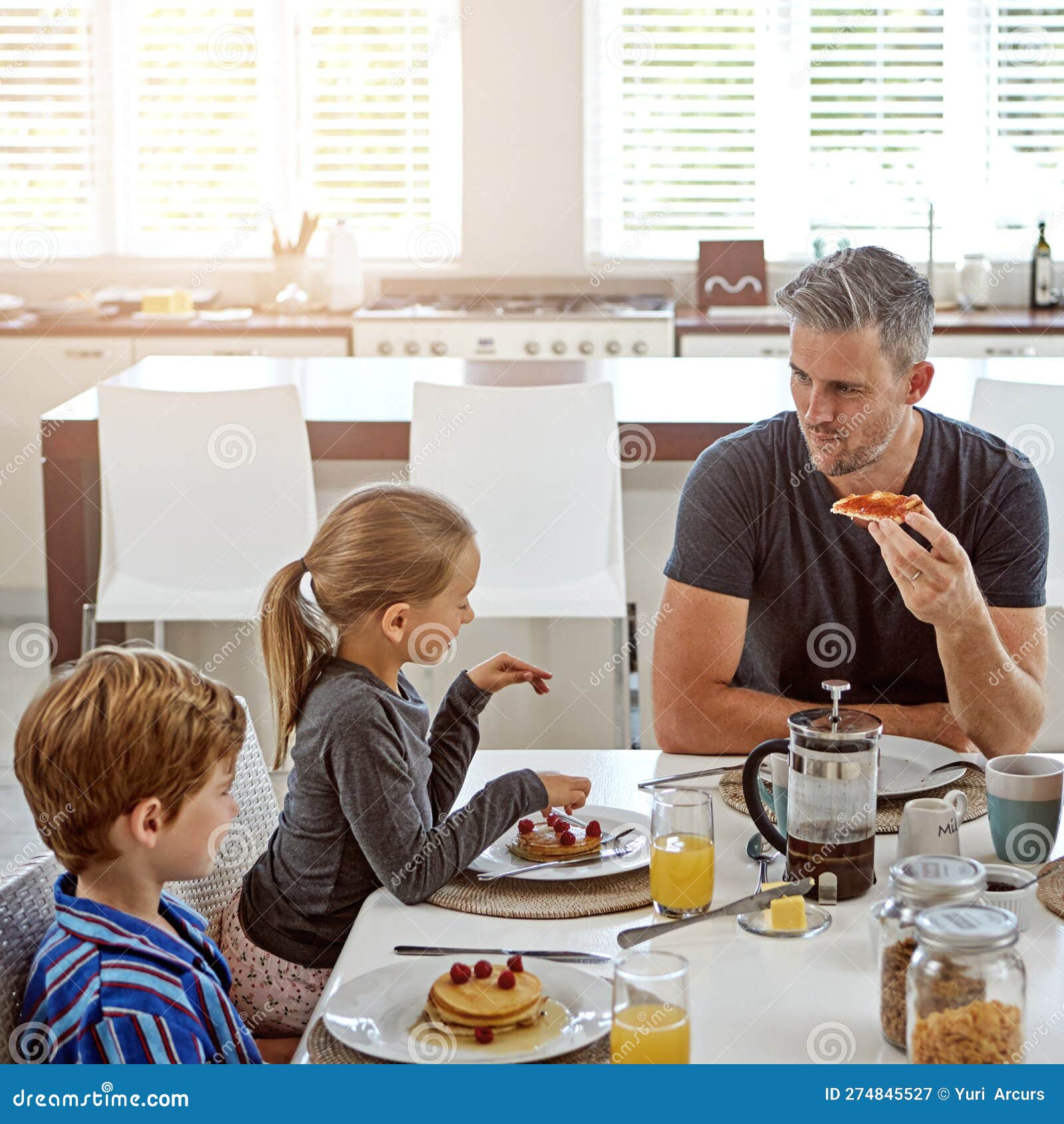 Hes a Hands-on Dad. a Family Having Breakfast Together. Stock Image ...