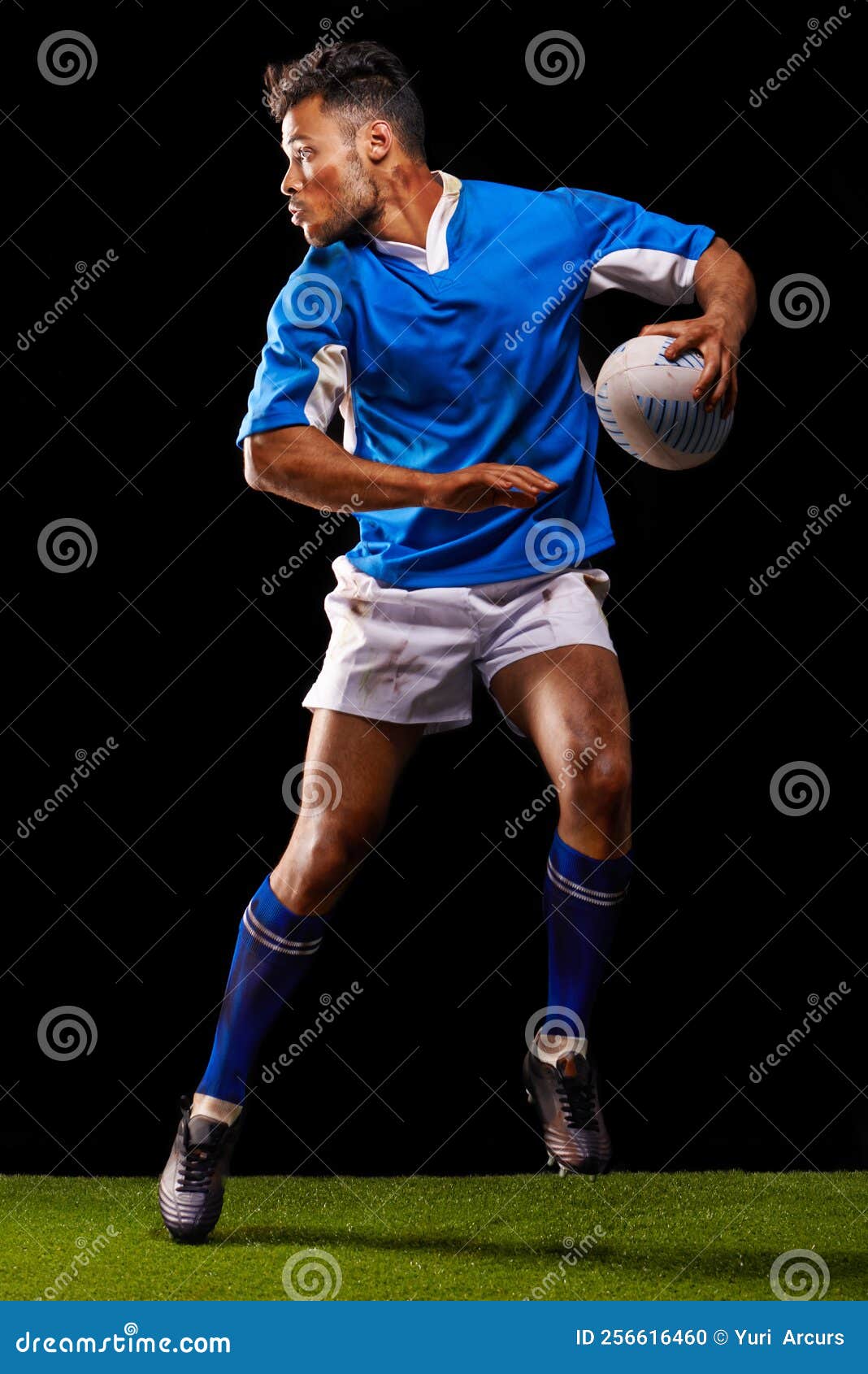 And Hes in the Lead. a Young Rugby Player on the Field. Stock Photo ...