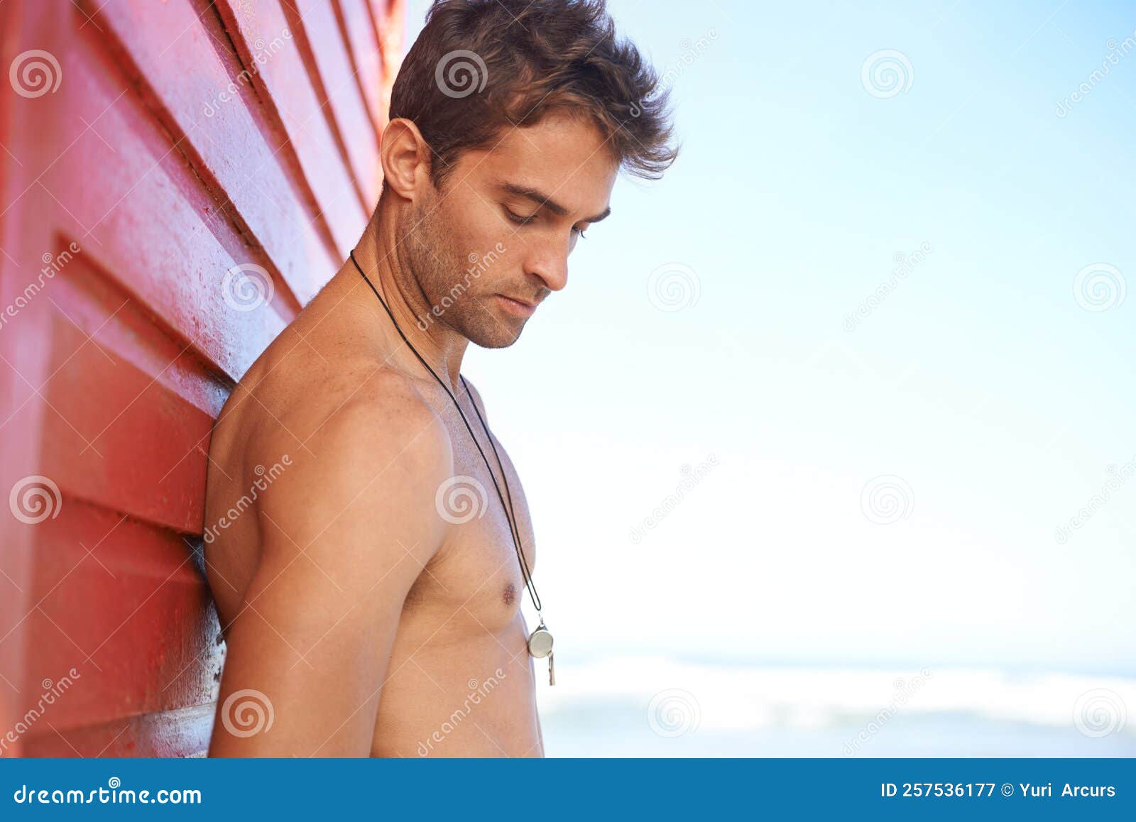 Hes Looking Out for Danger in the Water. a Handsome Young Lifeguard at ...