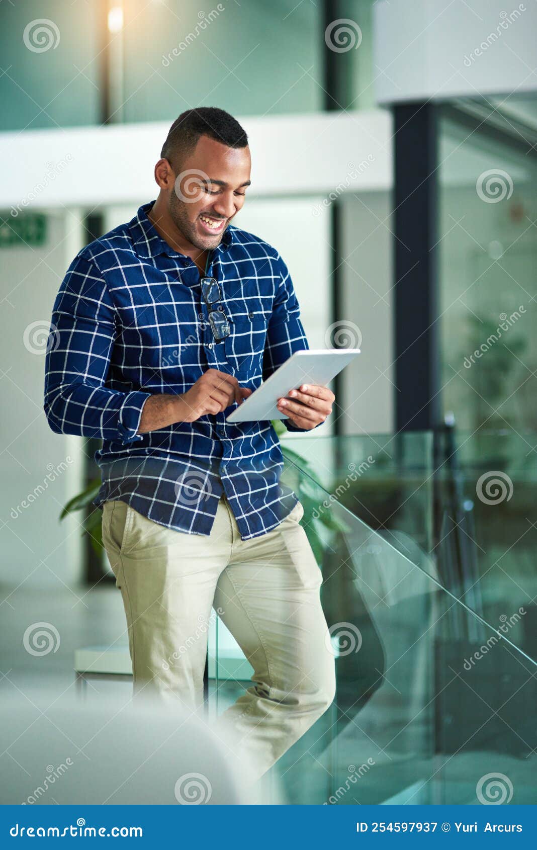 Hes Making Great Progress. a Handsome Young Businessman Using His ...