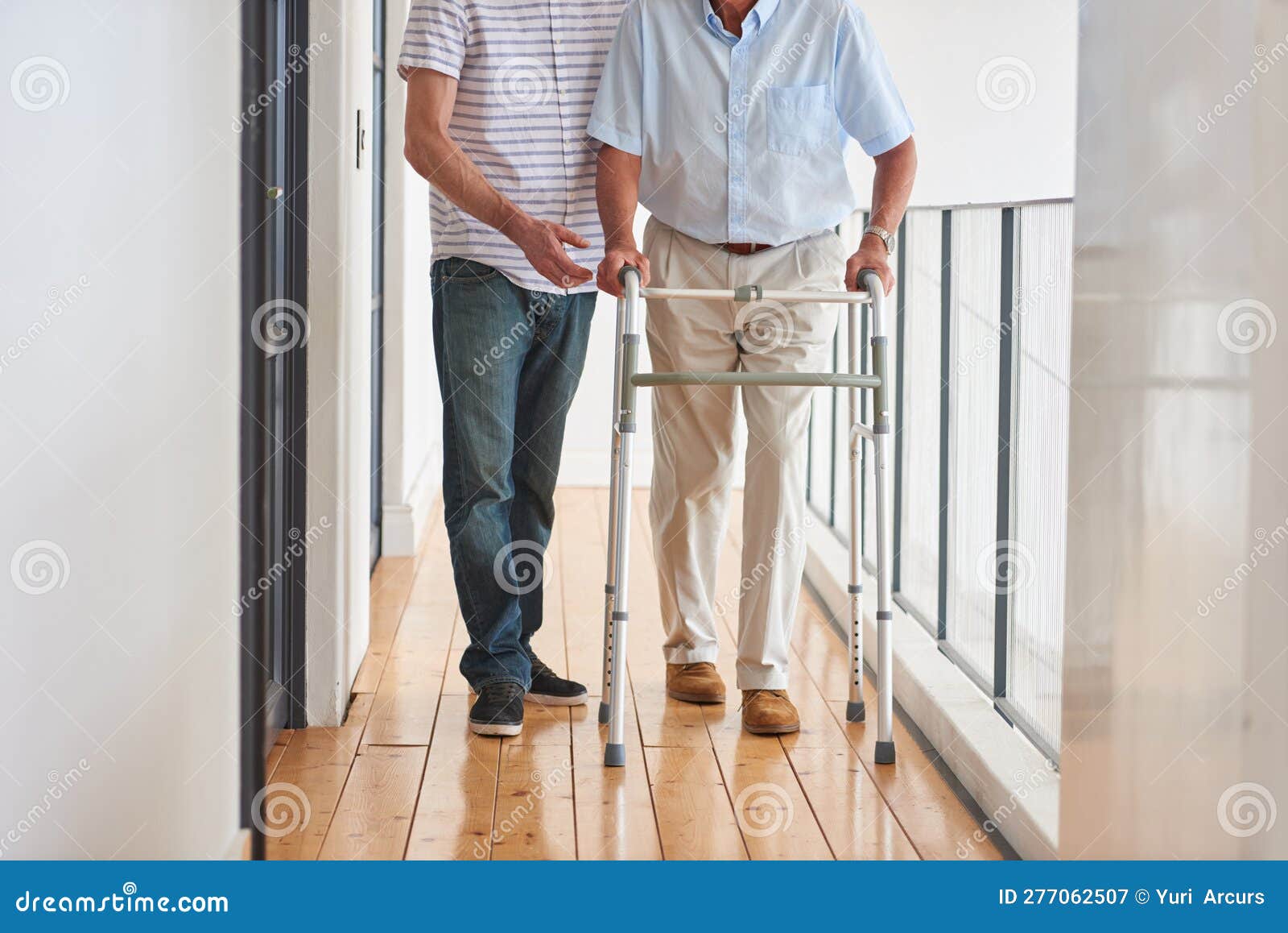 Hes Making Progress. a Man Assisting His Elderly Father with an ...