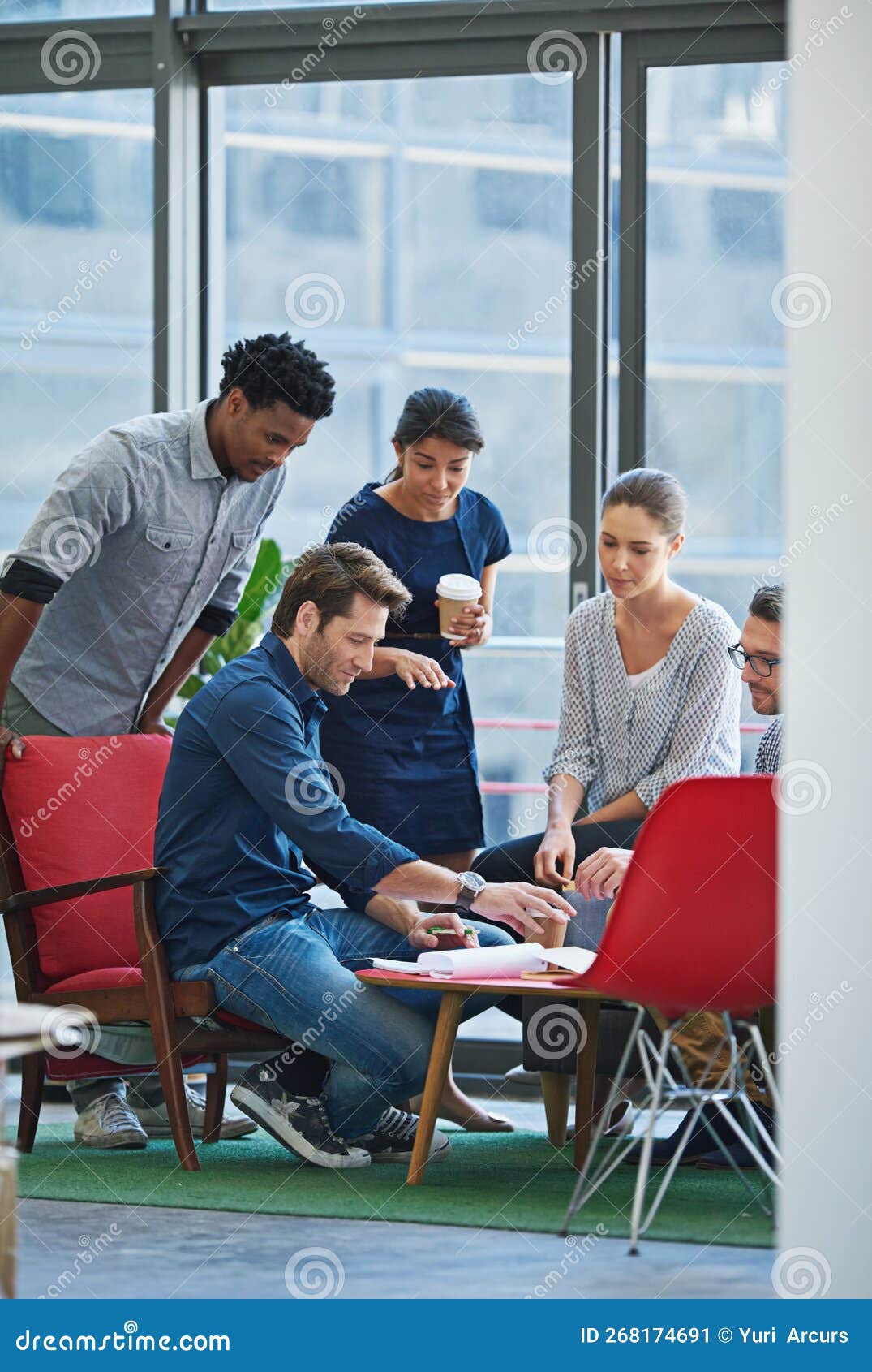 Hes the Man with the Plan. a Group of Office Workers Talking Together ...