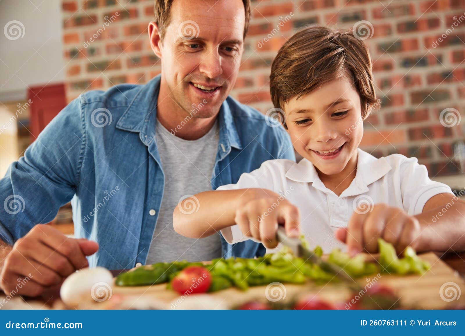 Hes a Masterchef in the Making. a Father Watching His Little Boy Chop ...