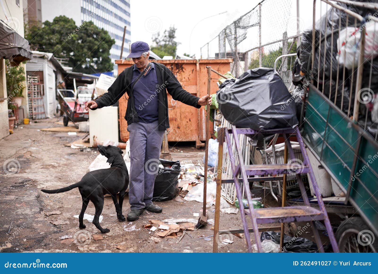Hes My Helper and Friend. a Man Sorting through Garbage at a Dumping ...