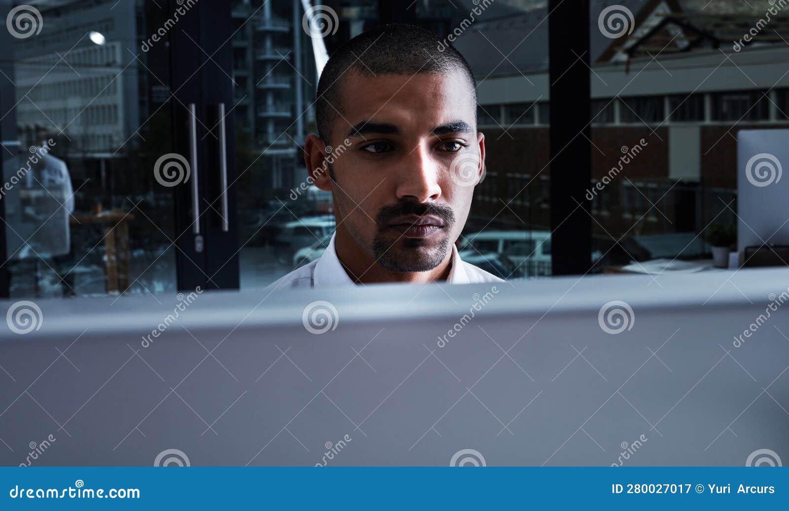 Hes Not Here To Be Average. a Young Businessman Using a Computer at ...