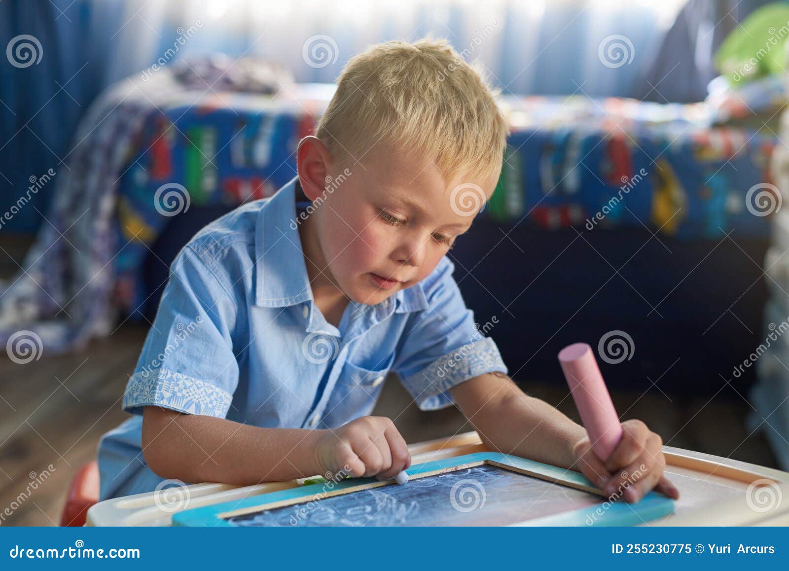 Hes Such a Creative Little Kid. a Little Boy Writing on a Chalkboard at ...
