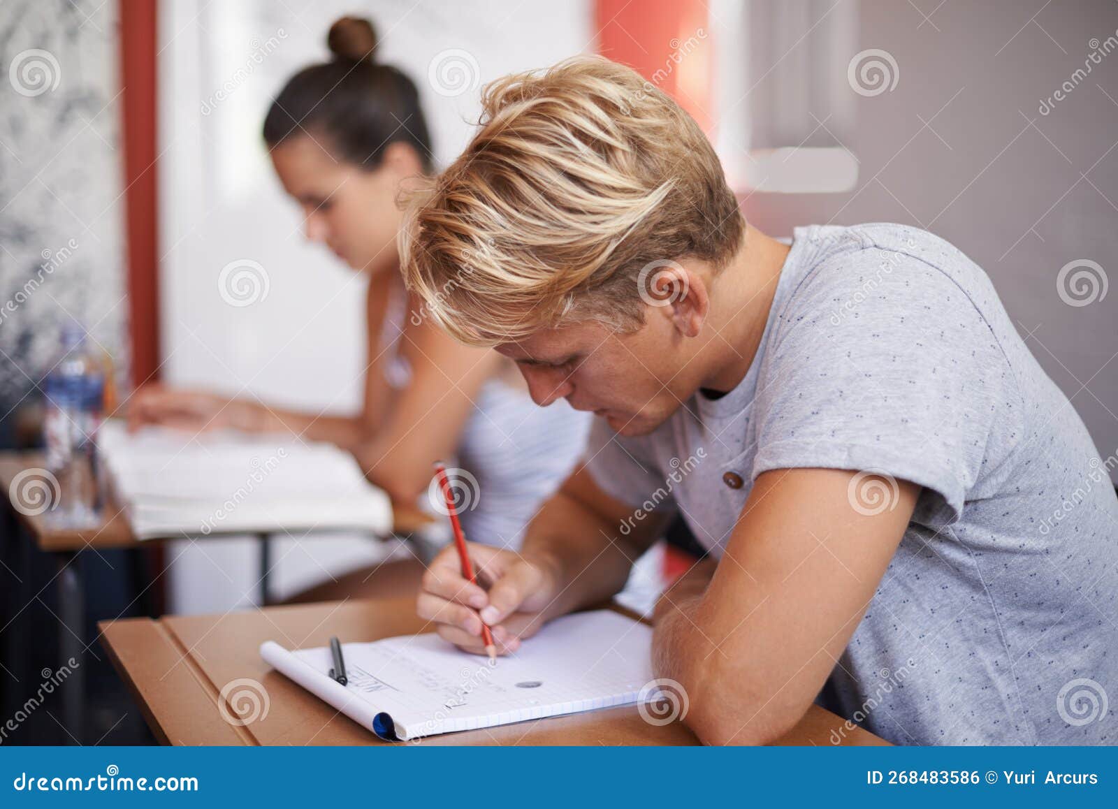 Hes Totally Focused. a Group of University Students Studying Together ...