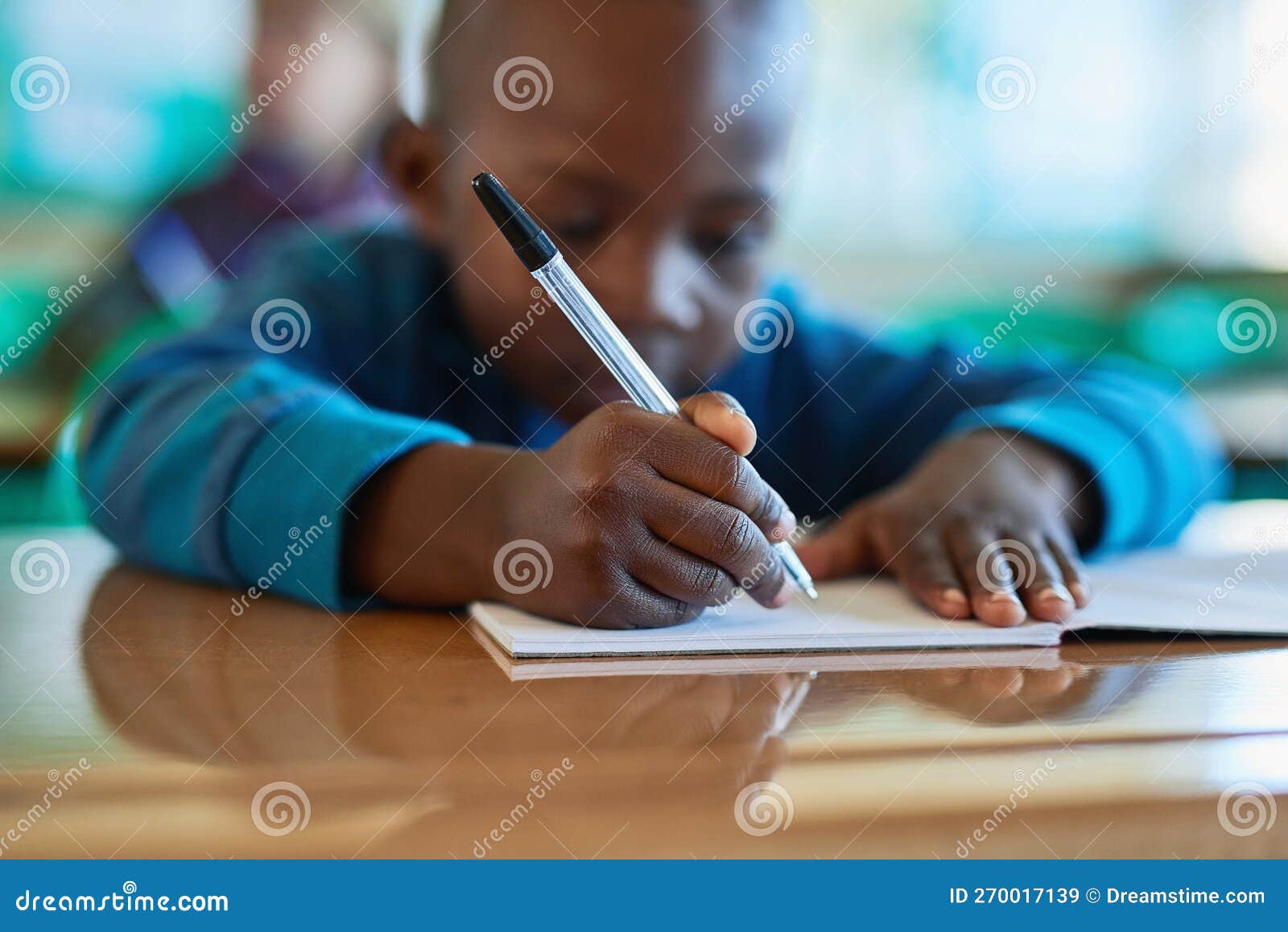 Hes a Very Eager Student. an Elementary School Boy Working in Class ...