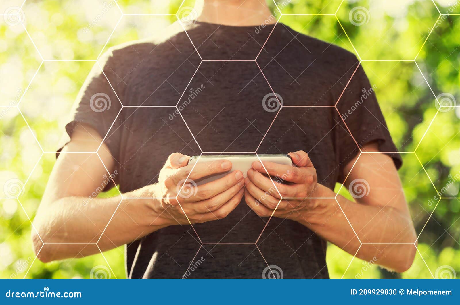 Hexagon Grid with Man Holding His Smartphone Stock Photo - Image of ...