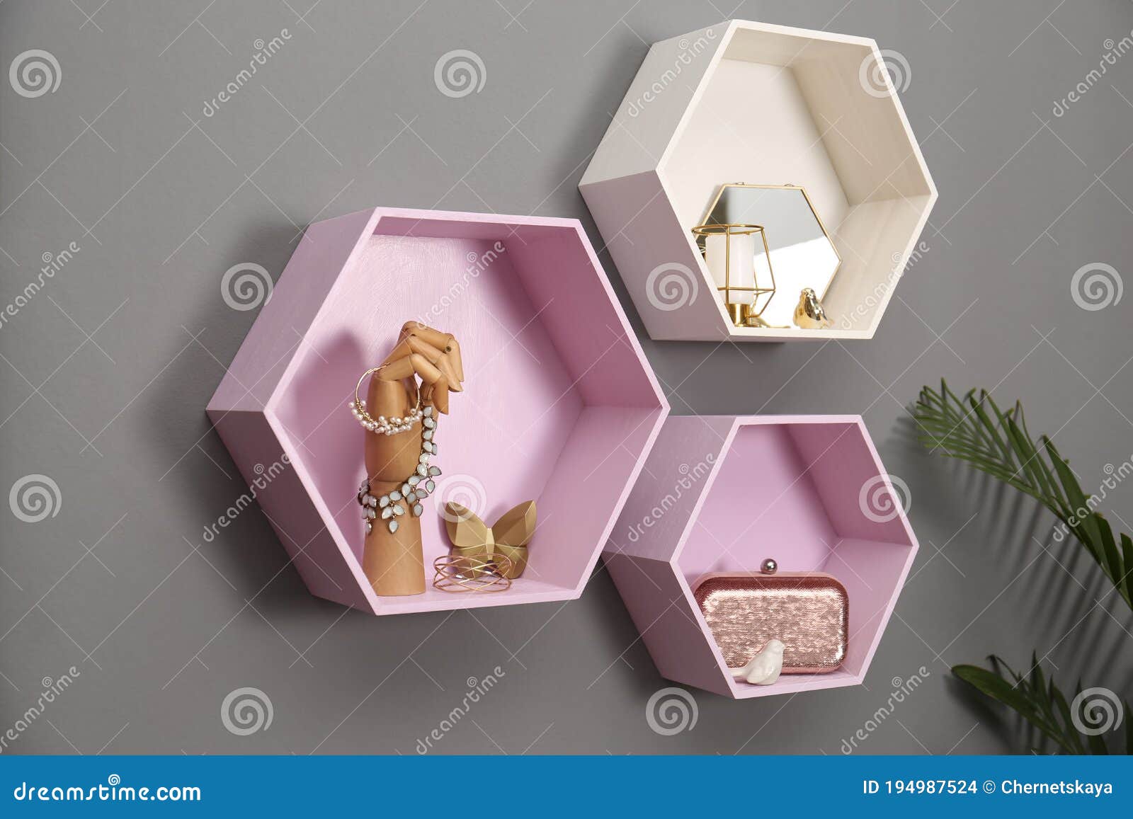 Hexagon Shaped Shelves with Different Stuff on Wall. Interior Design ...
