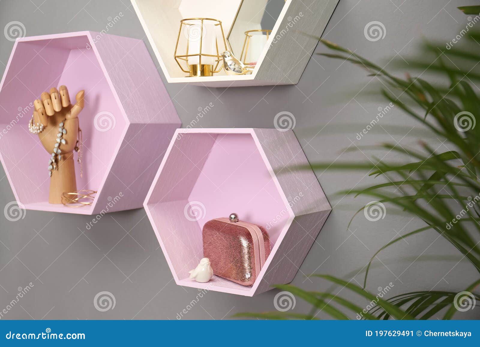 Hexagon Shaped Shelves with Different Stuff on Grey Wall. Interior ...