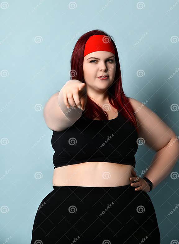 Hey Go On A Diet Fat Redhead Girl In A Red Headband Black Top She Points At You Posing On A
