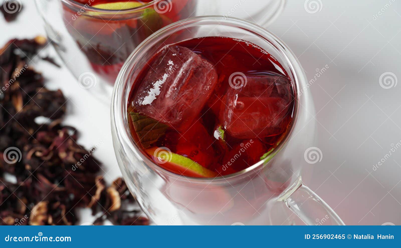 Hibiscus Cold Tea Drink with Ice Cubes and Lemon in Glass Stock Image ...