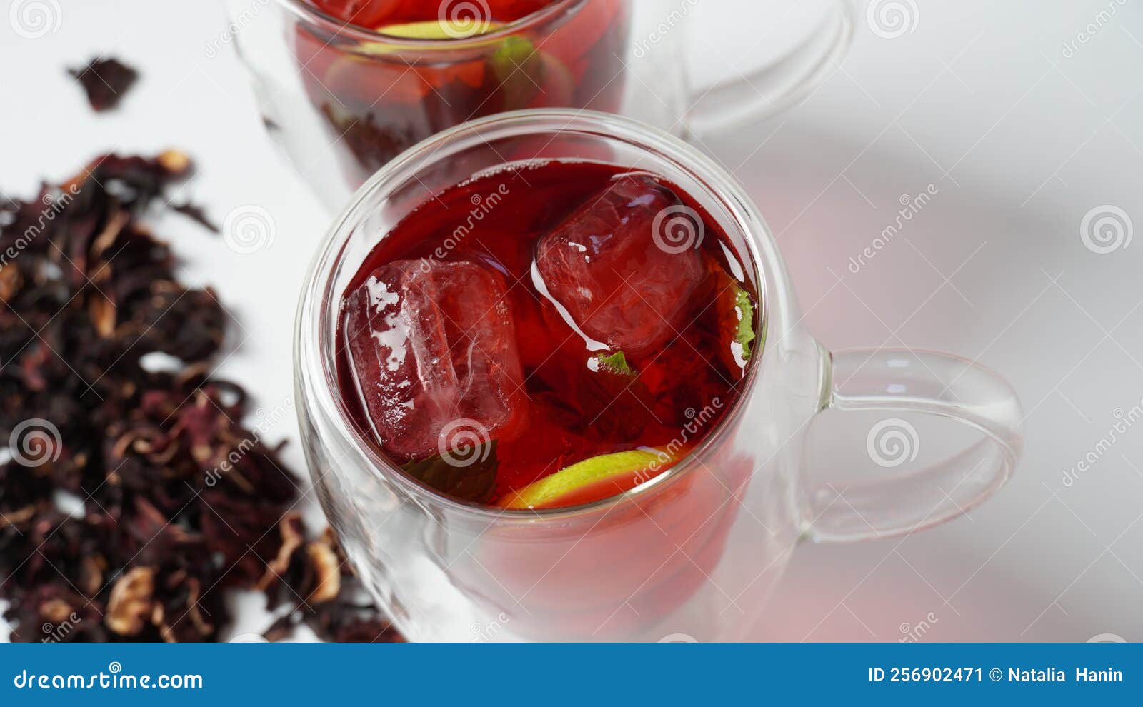 Hibiscus Cold Tea Drink with Ice Cubes and Lemon in Glass Stock Image ...