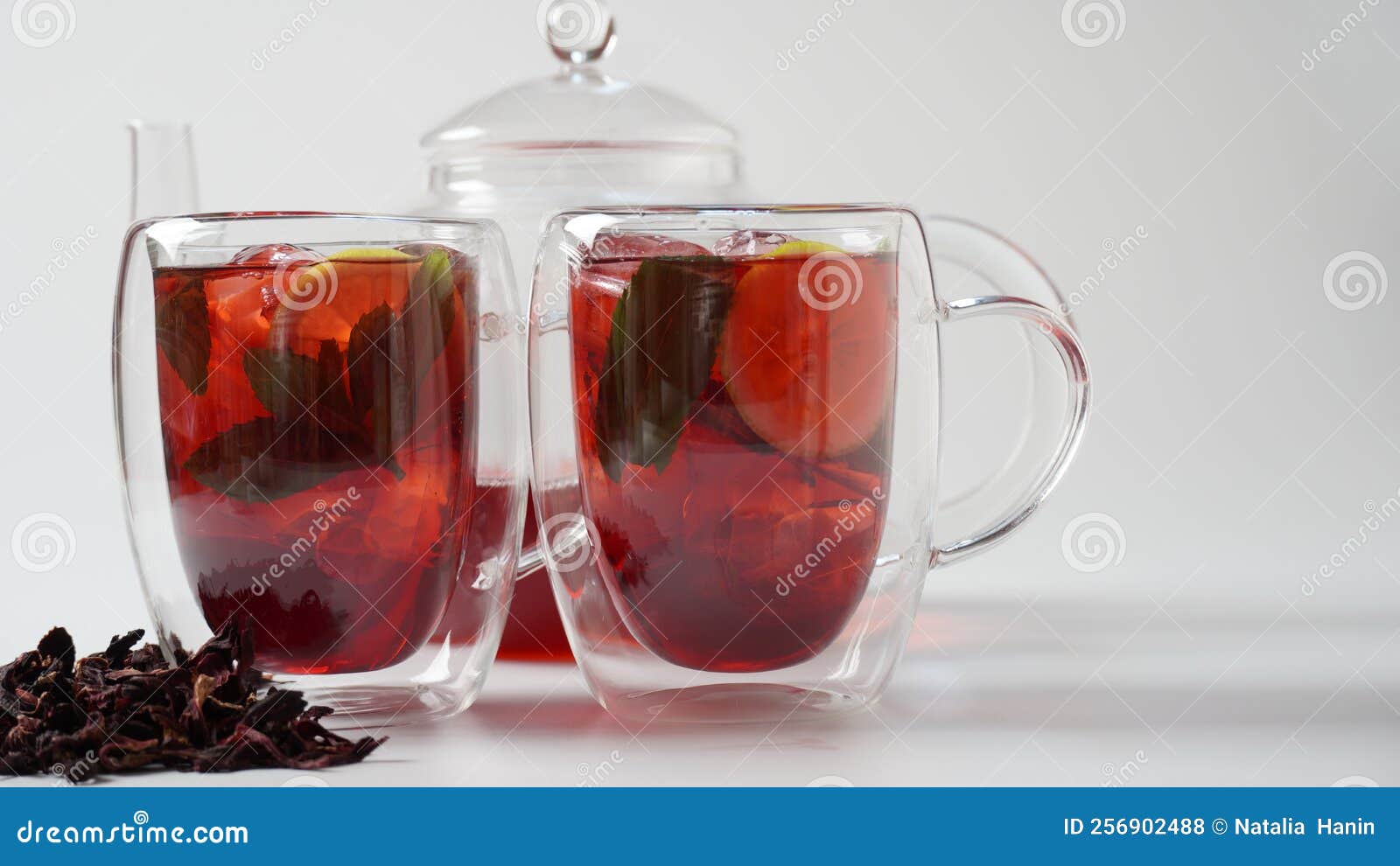 Hibiscus Cold Tea Drink with Ice Cubes and Lemon in Glass Stock Photo ...