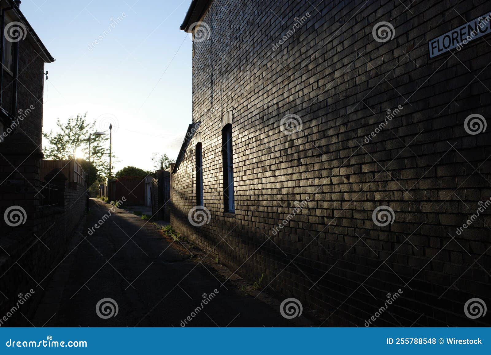 Hidden Dark Alley Next To a Brick Building. Stock Photo - Image of ...