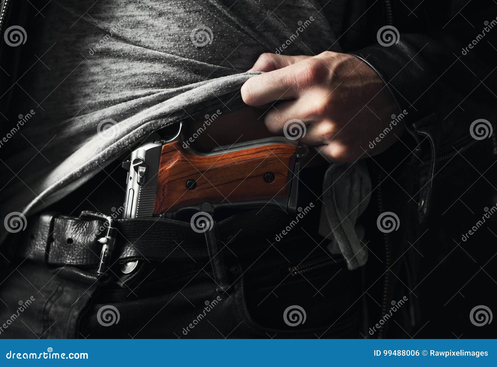 A Hidden Gun Under the Shirt Stock Photo - Image of dangerous, solo ...
