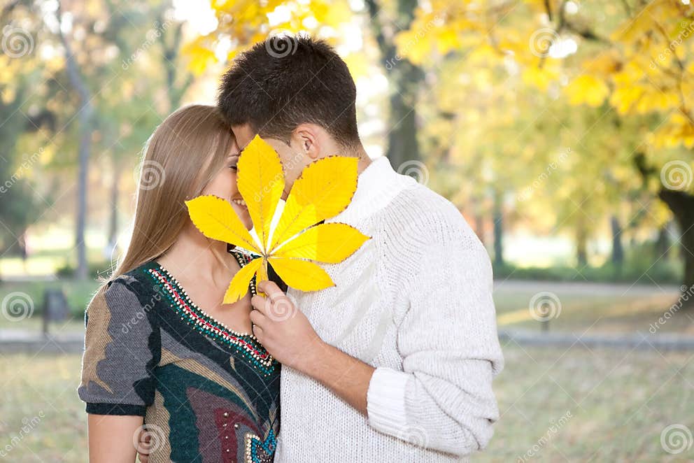 Hidden kiss stock image. Image of lifestyle, autumn, embracing - 24783949