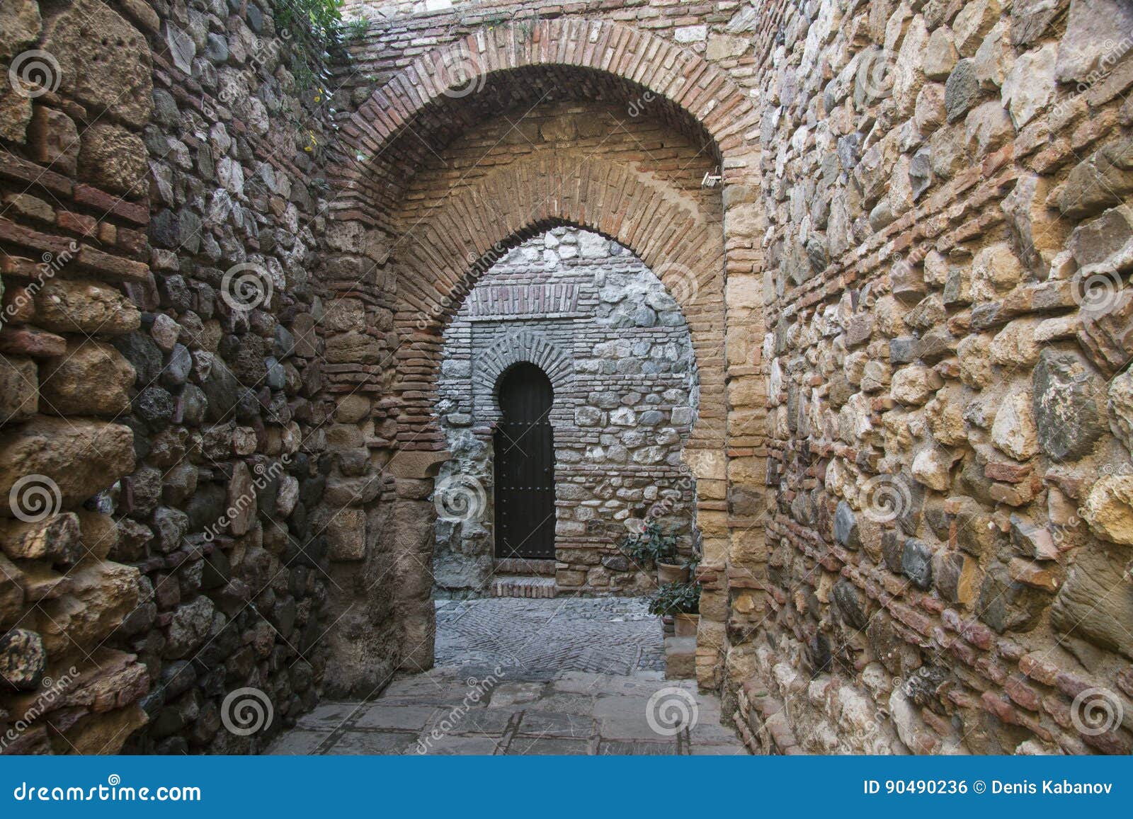 Hidden Stone Passageway in Malaga Fortress with Archs and Gate Stock ...