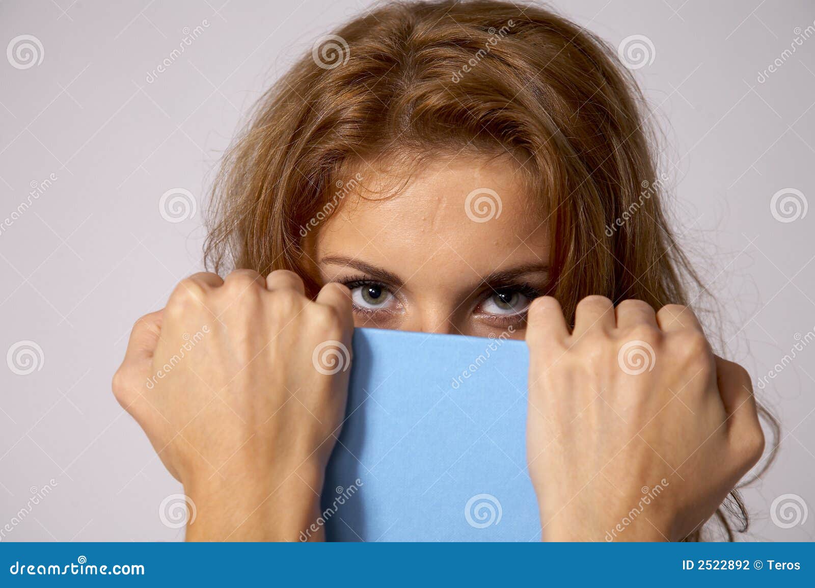 Hiding stock photo. Image of blue, hands, book, female - 2522892