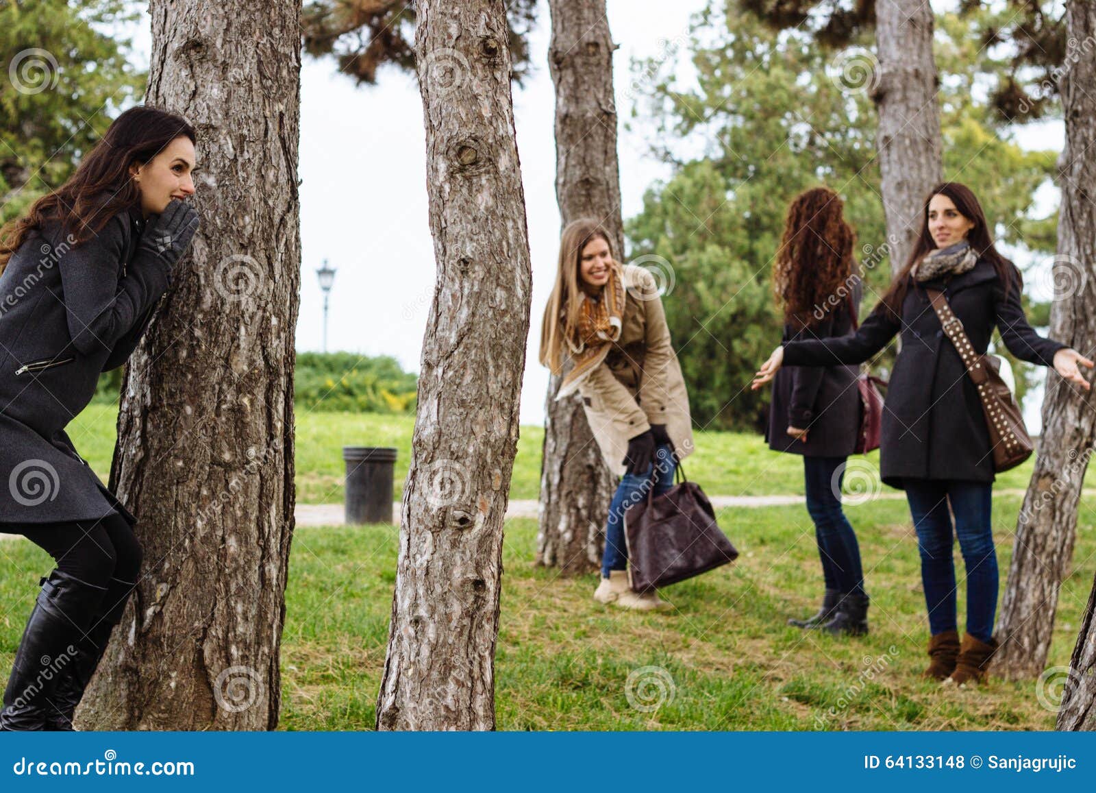 Hiding behind a tree stock photo. Image of looking, hiding - 64133148