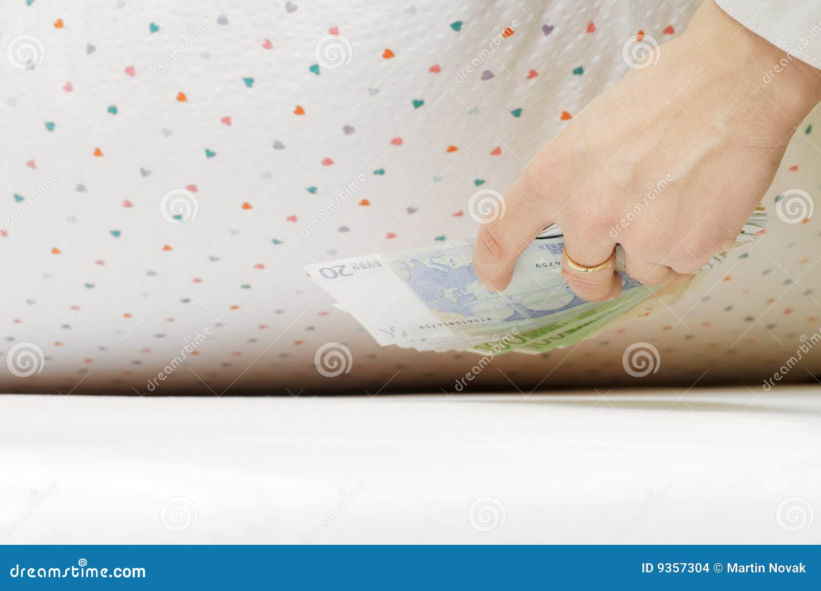 Hiding money under pillow stock photo. Image of inside - 9357304