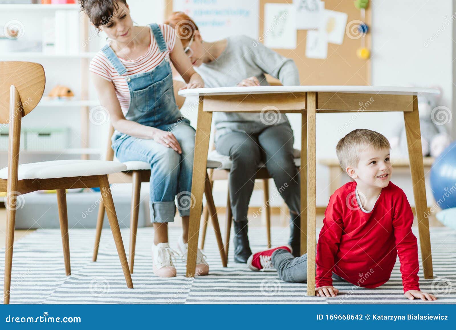 Hiding under the table stock photo. Image of psychotherapy - 169668642