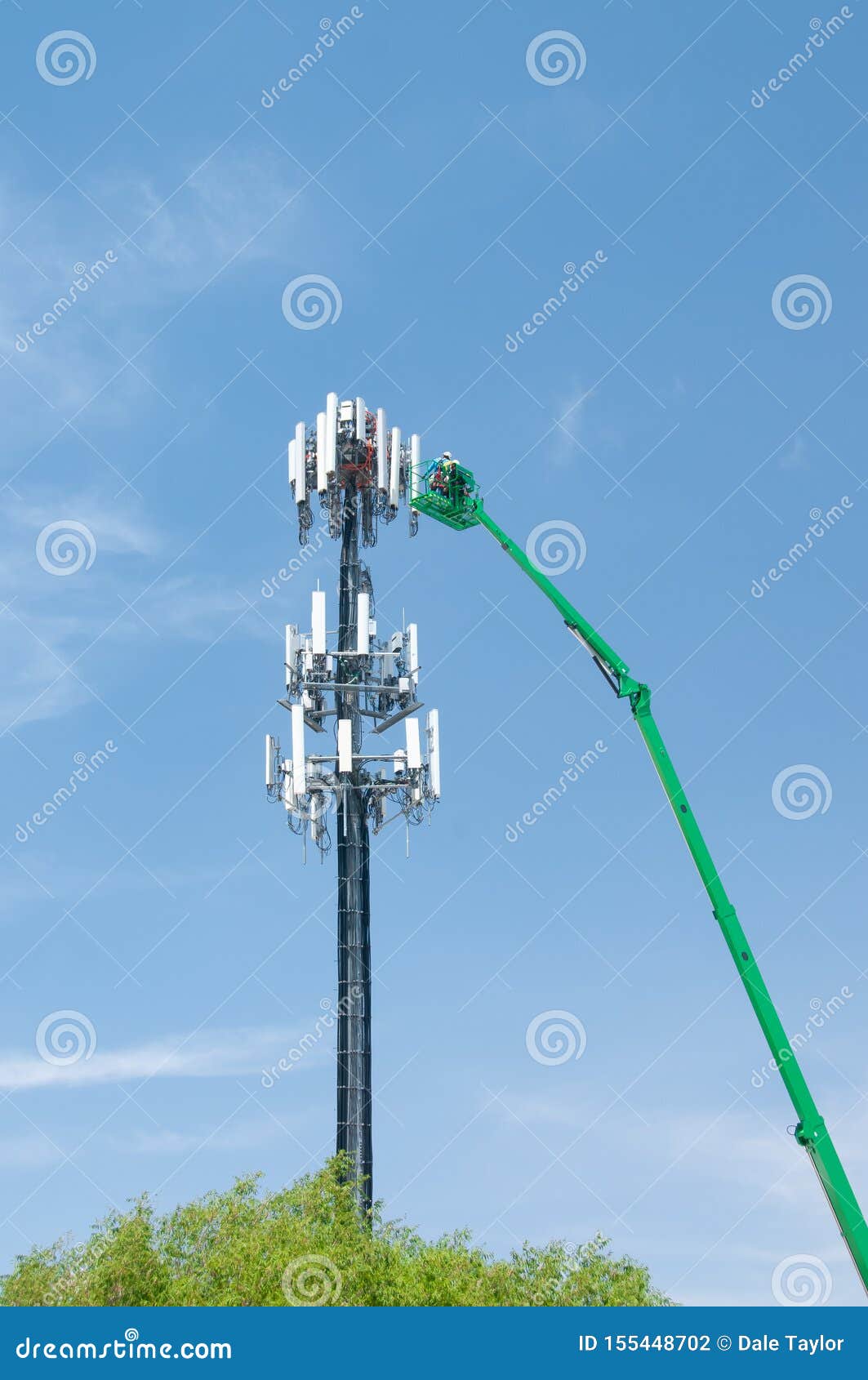 High In The Air, Workmen Maintain A Cell Tower Royalty-Free Stock ...