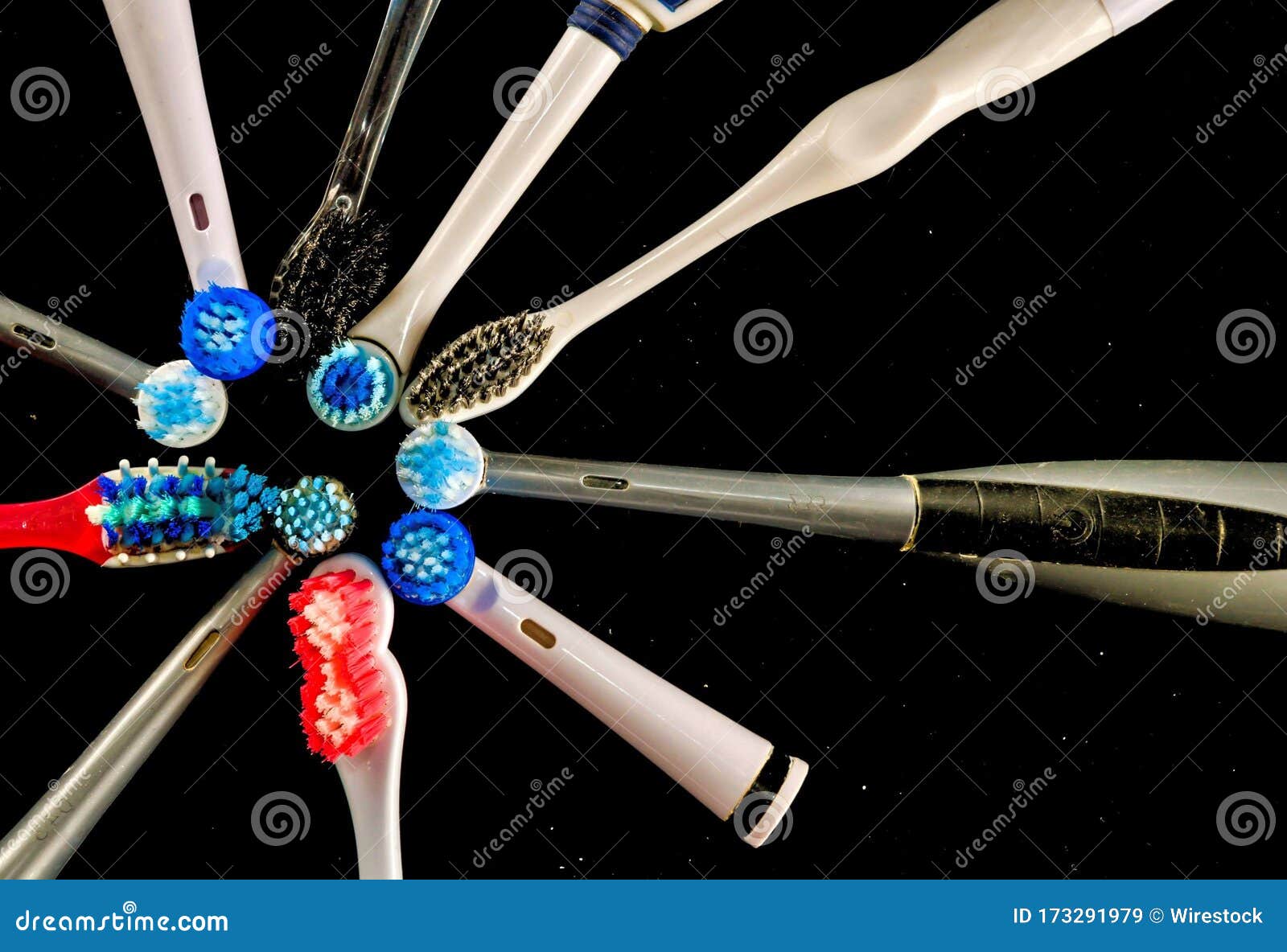High Angle Closeup Shot of Electric Toothbrushes on a Black Background ...