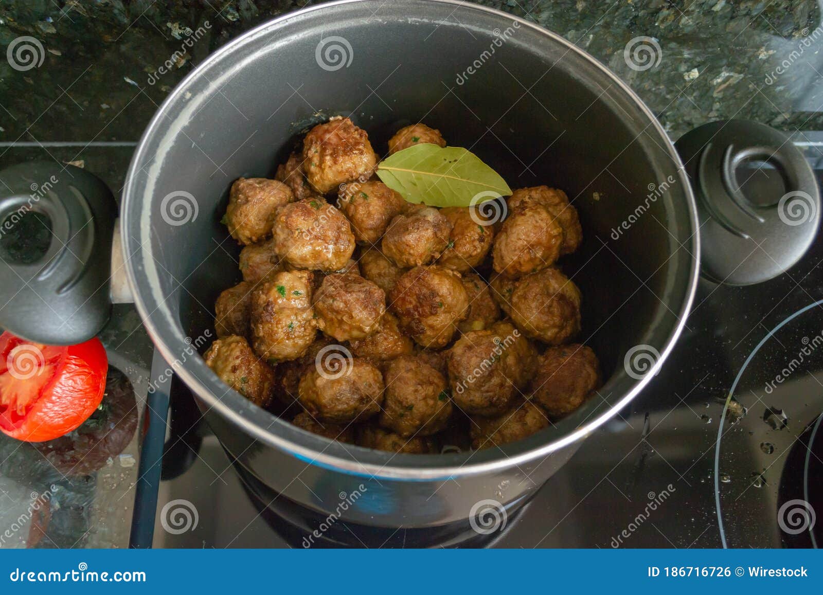 High Angle Closeup Shot of Meatballs and a Bay Leaf in the Cooker Stock ...