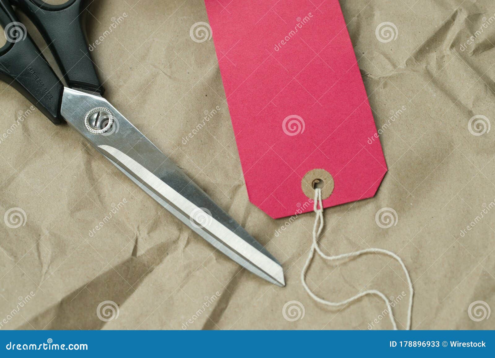 High Angle Closeup Shot of Scissors and a Red Label with Copy Space ...