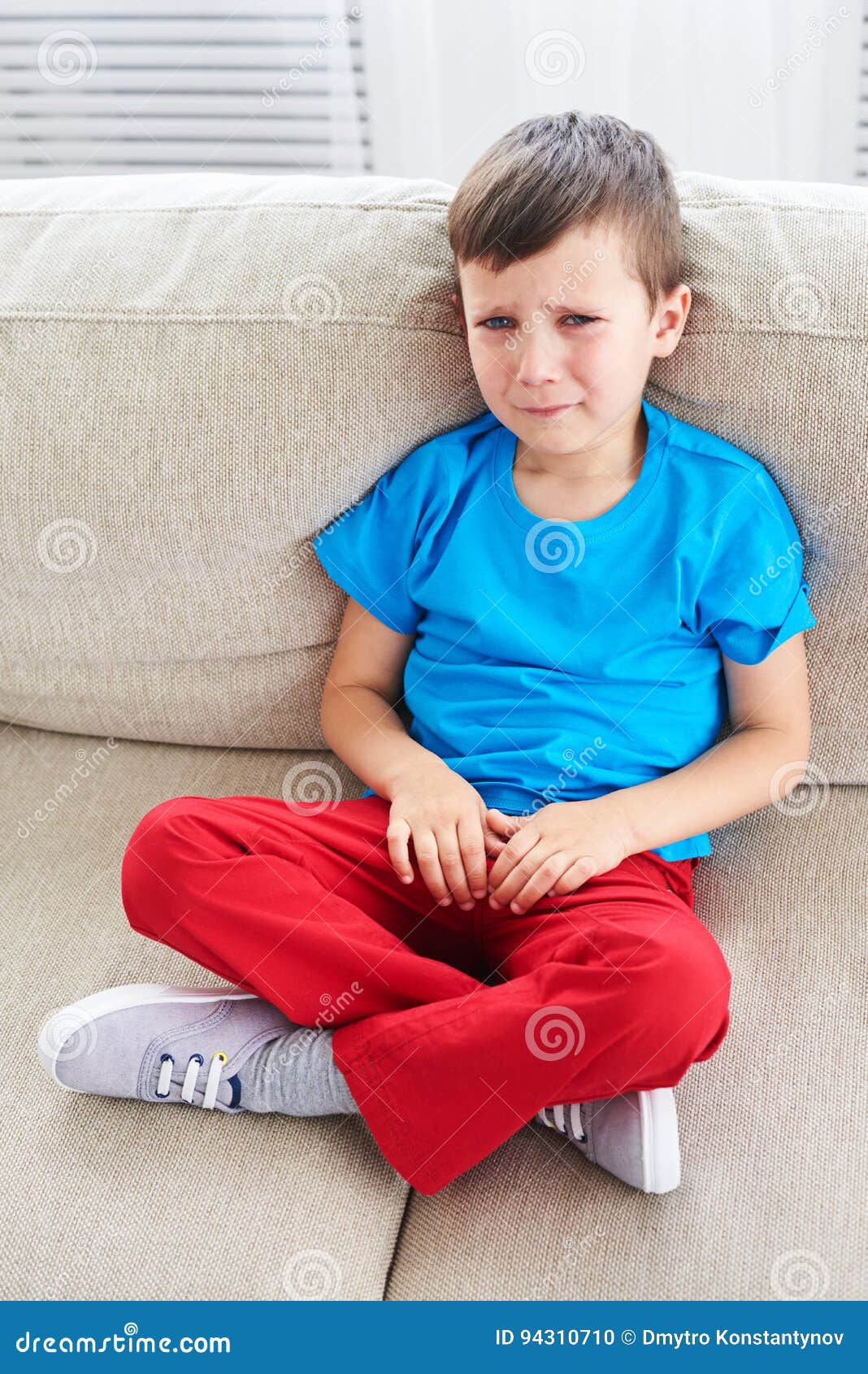 High Angle of Disappointed Boy Crying on Sofa Stock Photo - Image of ...