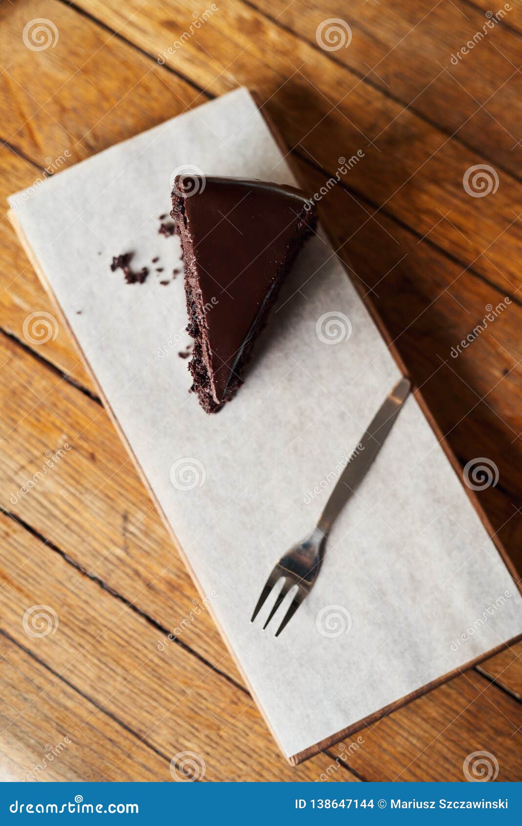Delicious Slice of Chocolate Cake Sitting on a Cafe Table Stock Photo ...