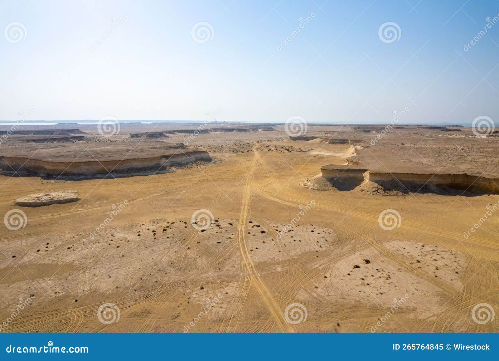 High-angle of Qatar Dessert on a Sunny Day, Clear and Sunlit Sky in the ...