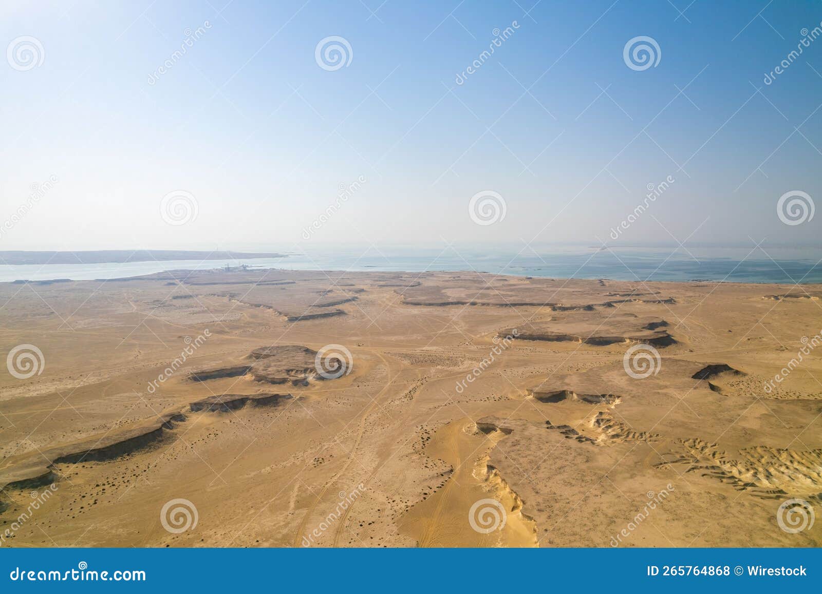 High-angle of Qatar Dessert on a Sunny Day, Clear and Sunlit Sky in the ...