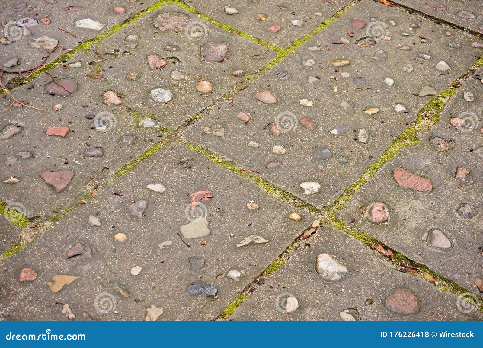 High Angle Shot of a Beautiful Cobblestone Ground with Small Red Stones ...